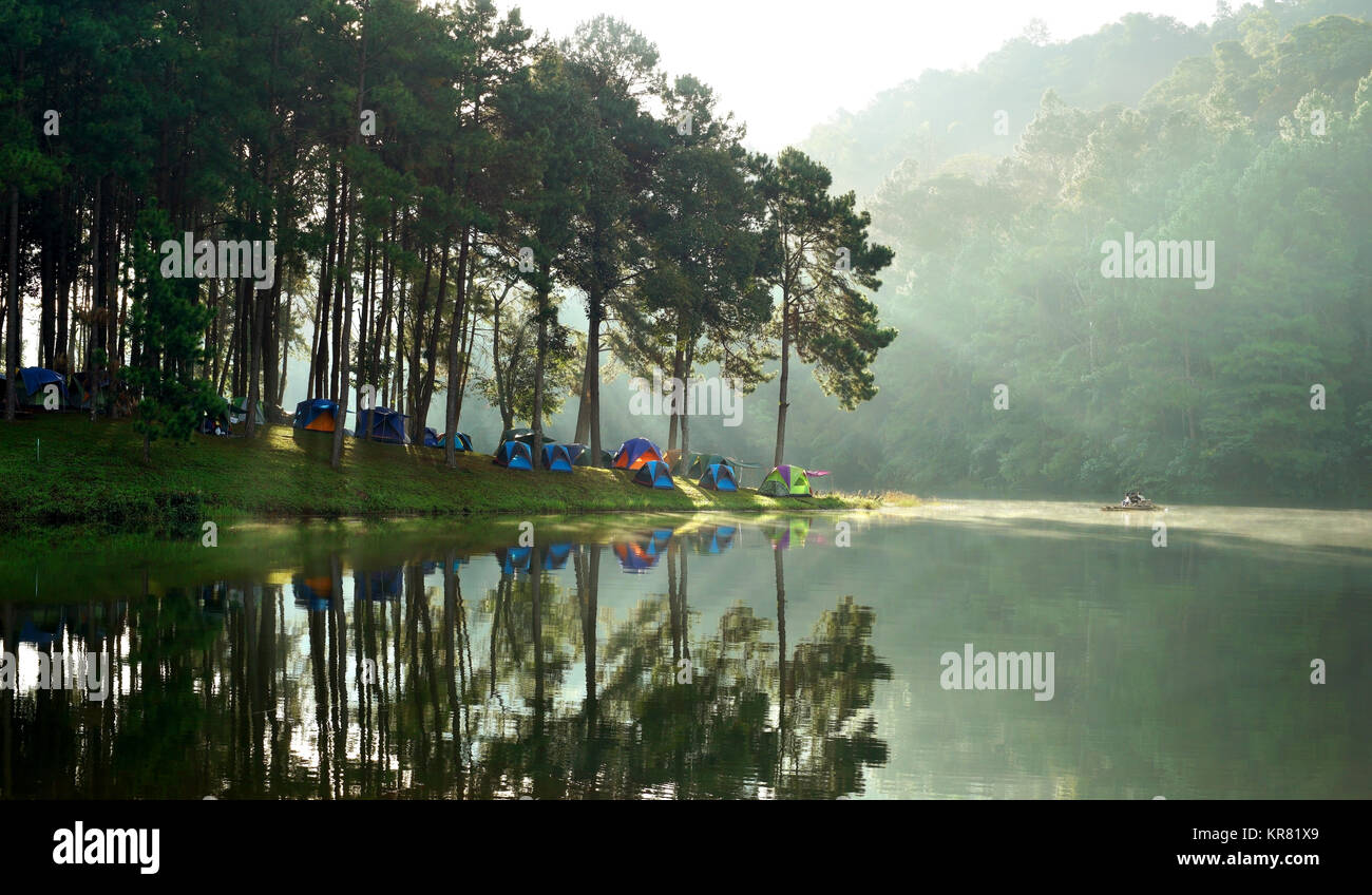 beautiful landscape, camping tents at outdoor camp site near the lake ...