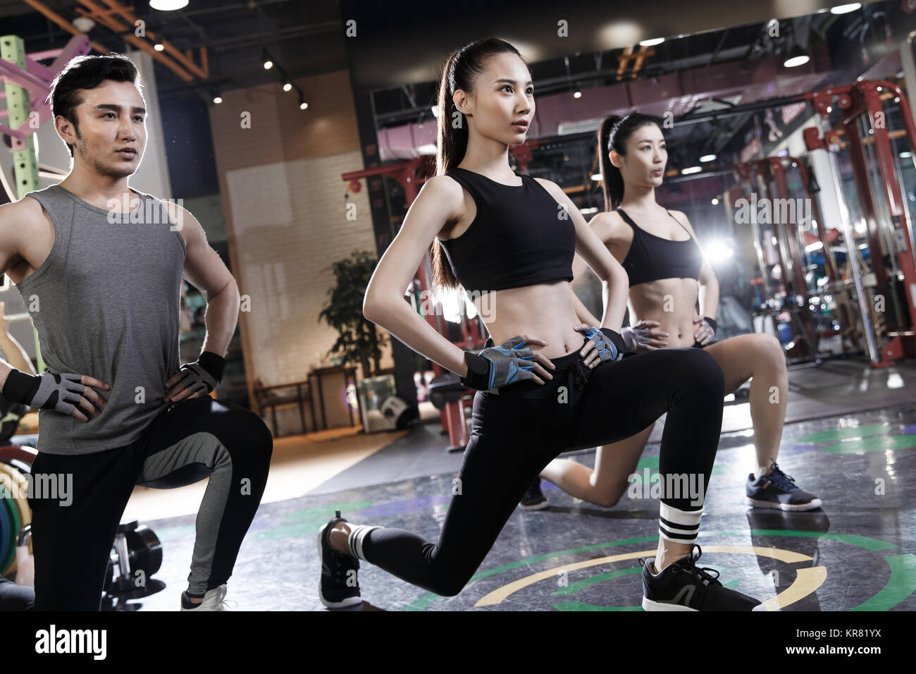 Young people exercise at the gym Stock Photo - Alamy