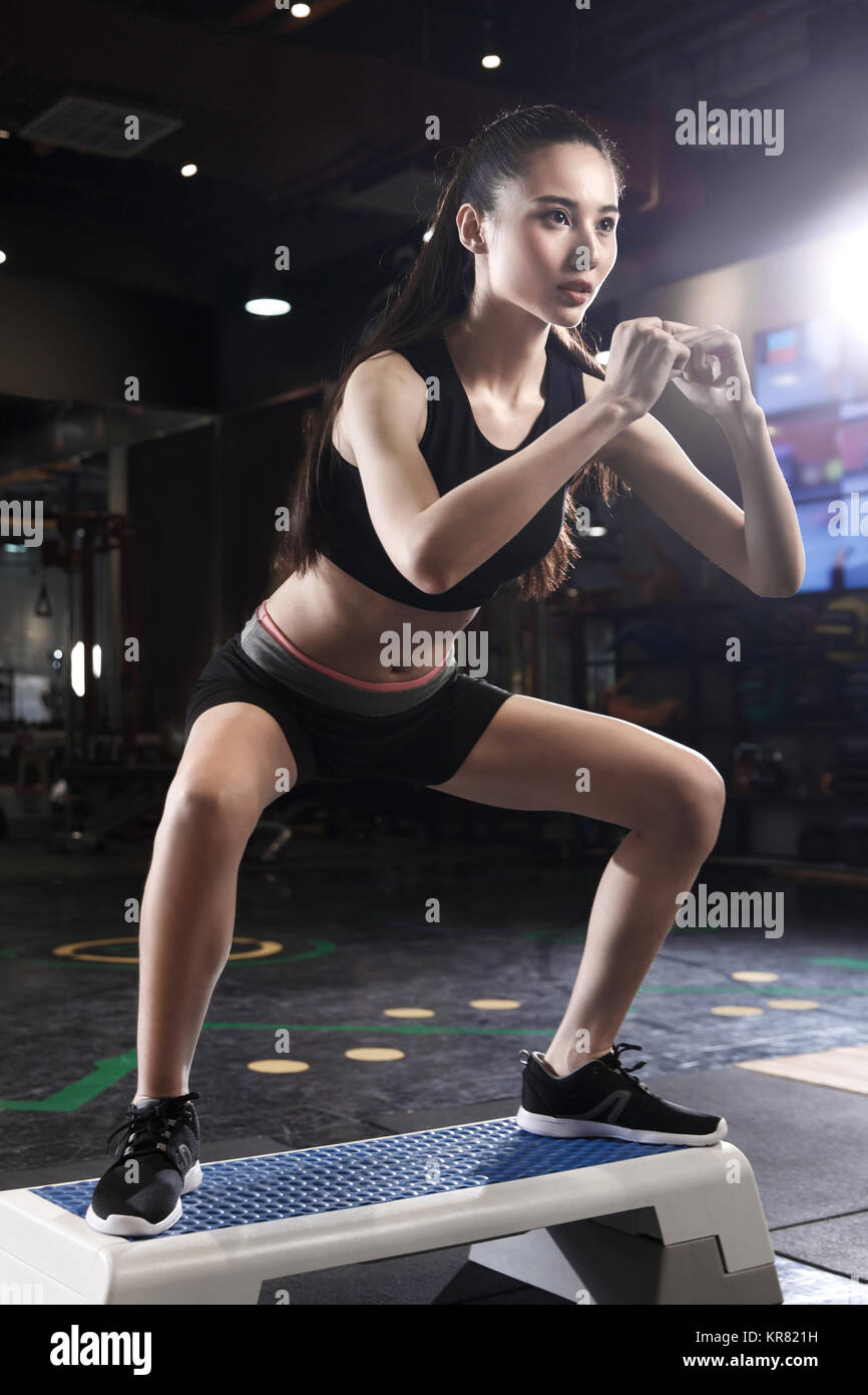 Young women exercise at the gym Stock Photo - Alamy