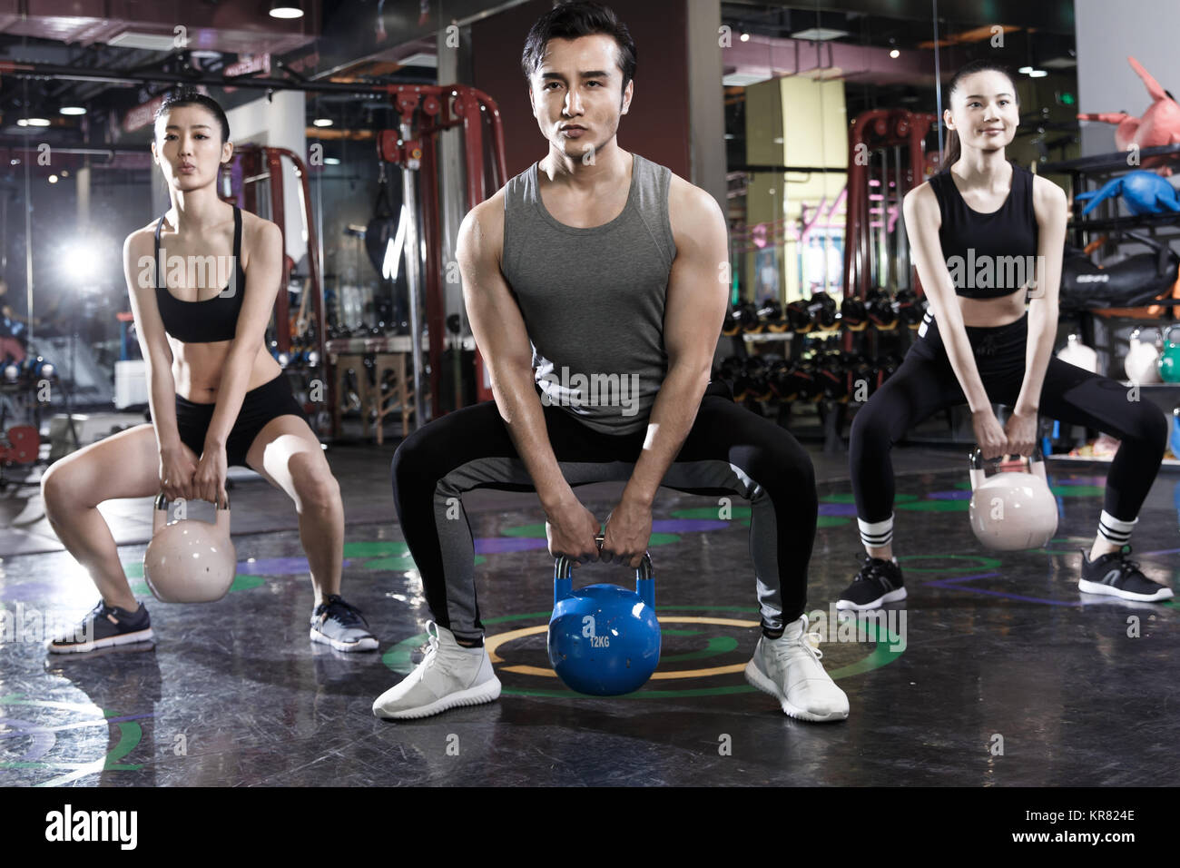 Young people exercise at the gym Stock Photo - Alamy