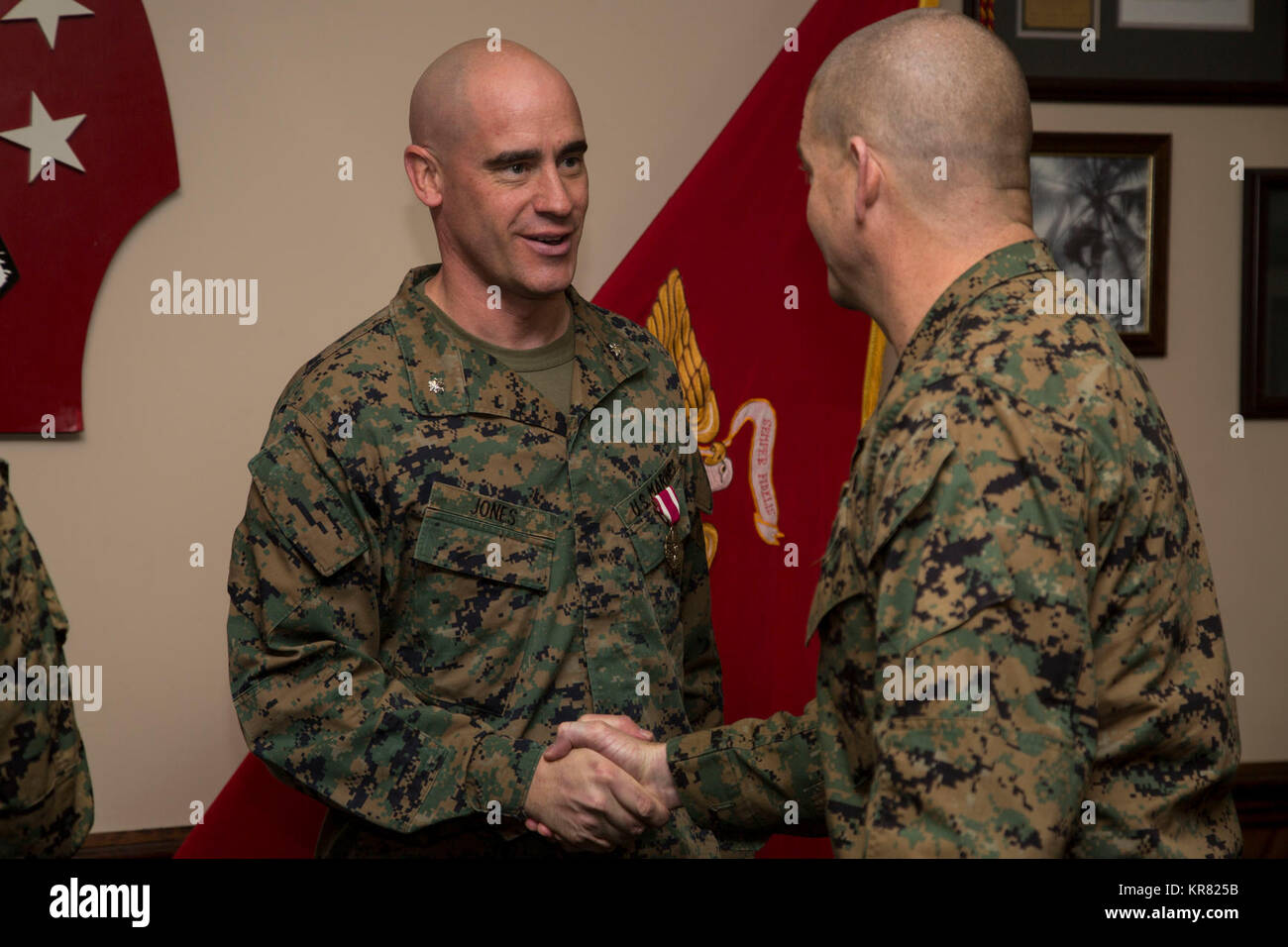 U.S. Marine Corps Lt. Col. Kemper A. Jones, left, shakes hands with ...