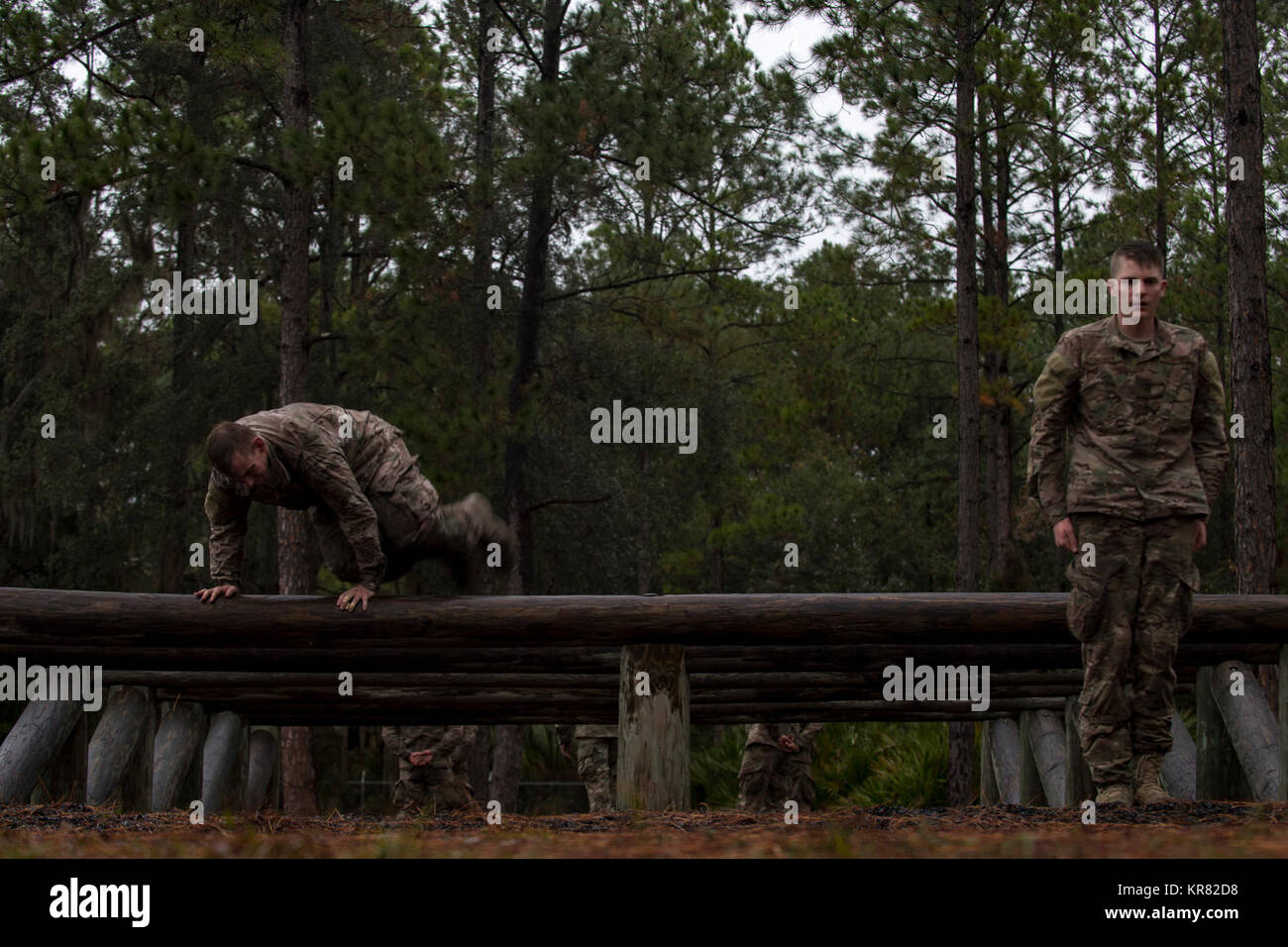 Airmen from the 820th Base Defense Group navigate an obstacle during an ...