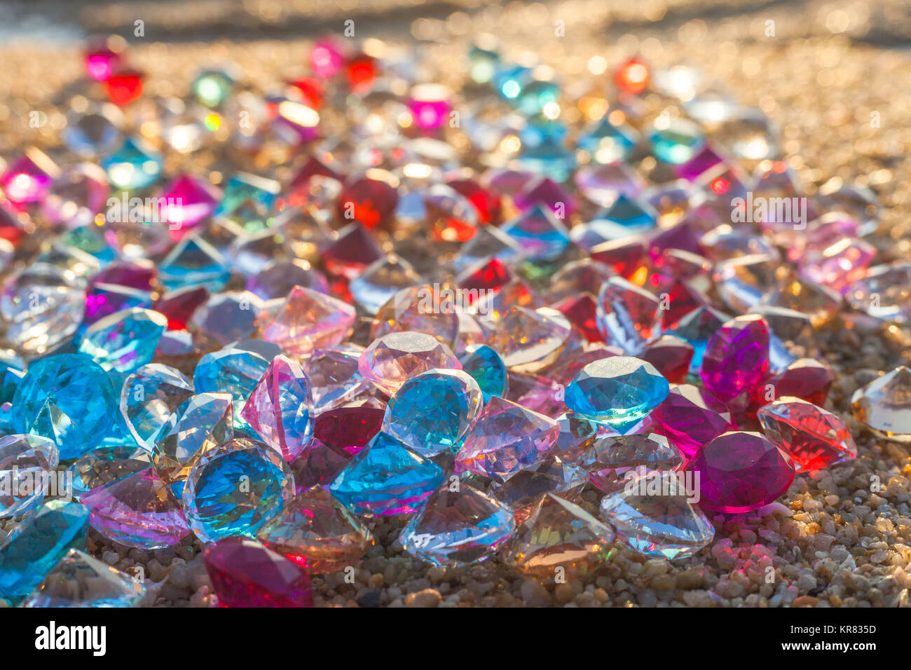 sunshine on the beach in the morning light through gemstones are ...