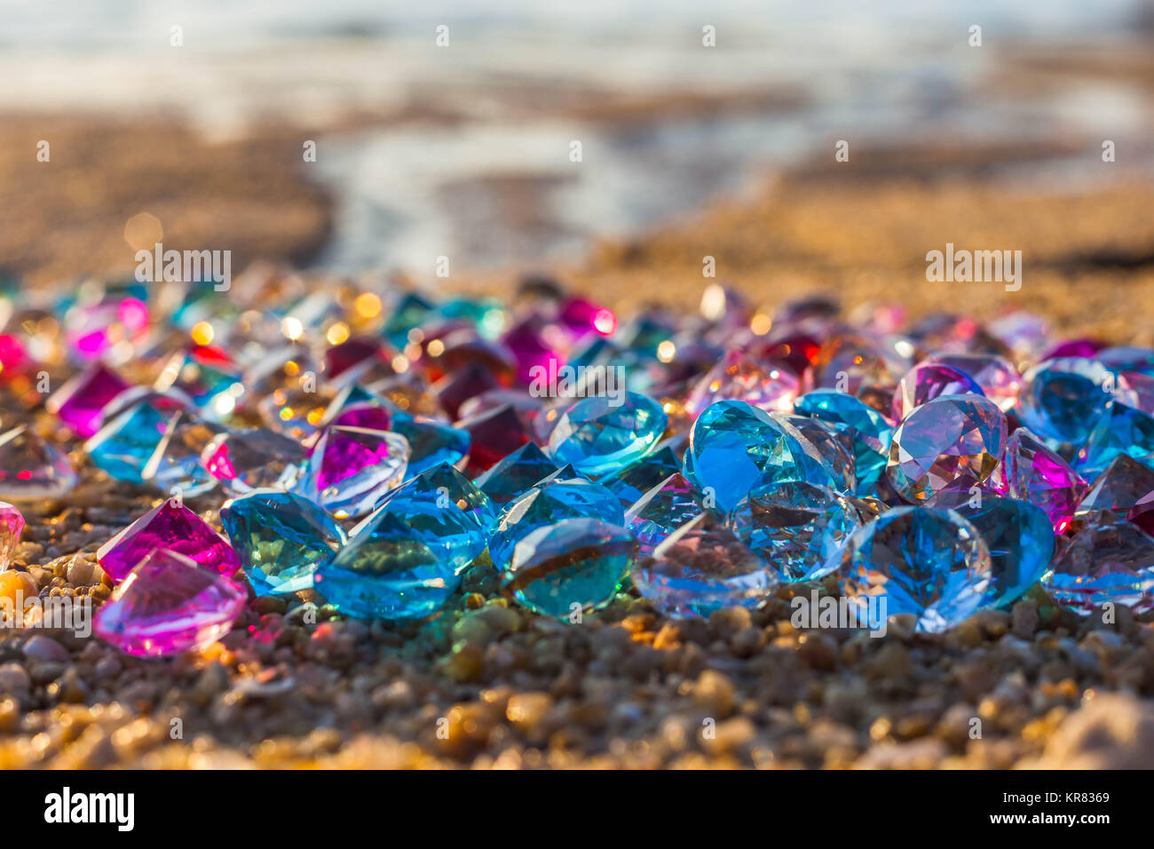 a lot of diamonds are scattered about on the beach Stock Photo - Alamy