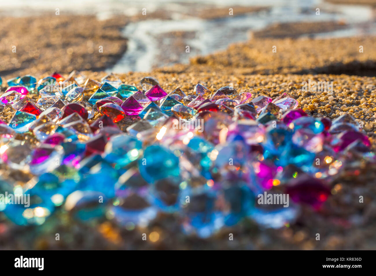 a lot of diamonds are scattered about on the beach Stock Photo - Alamy