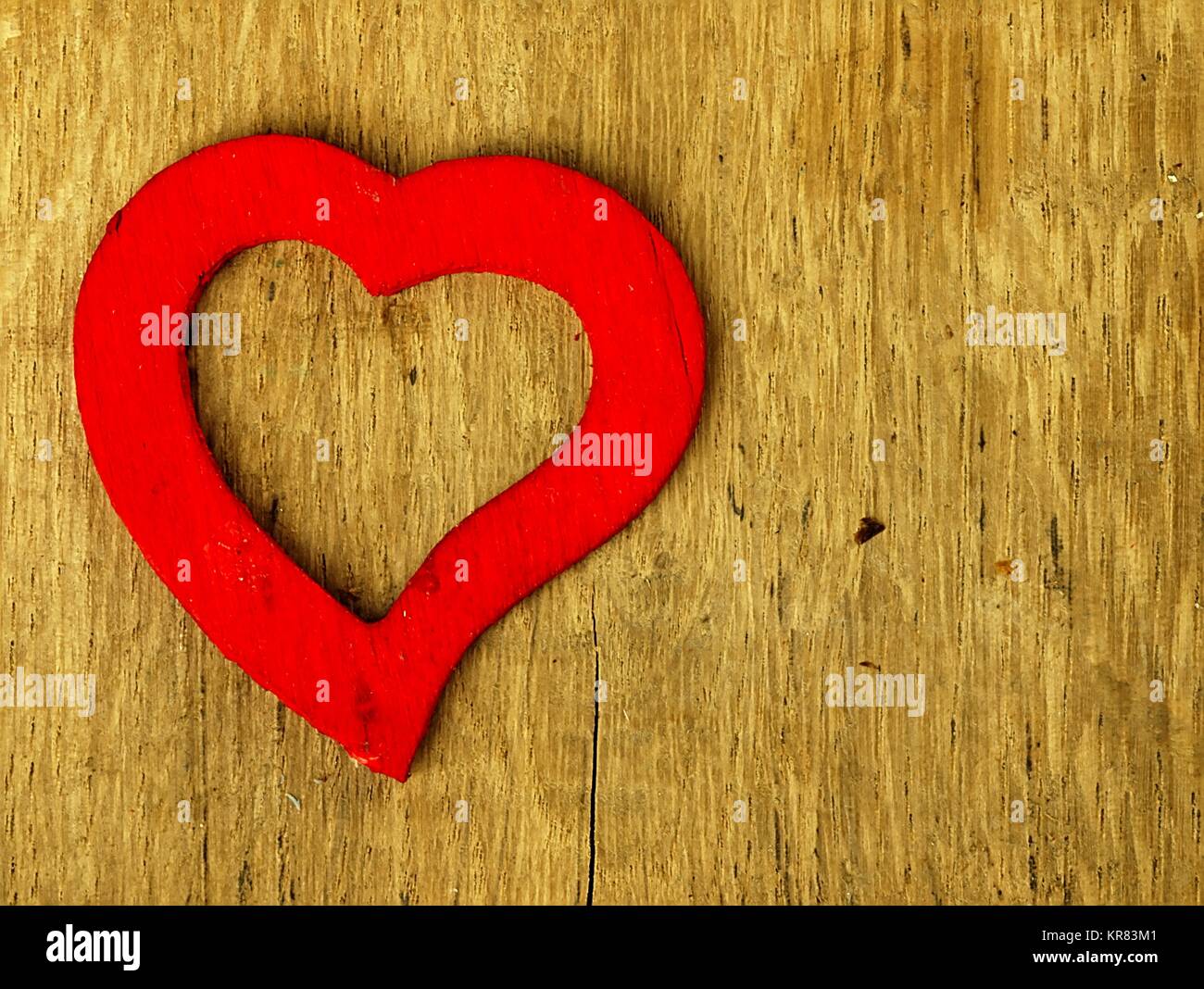 Wooden heart on the oak table Stock Photo - Alamy