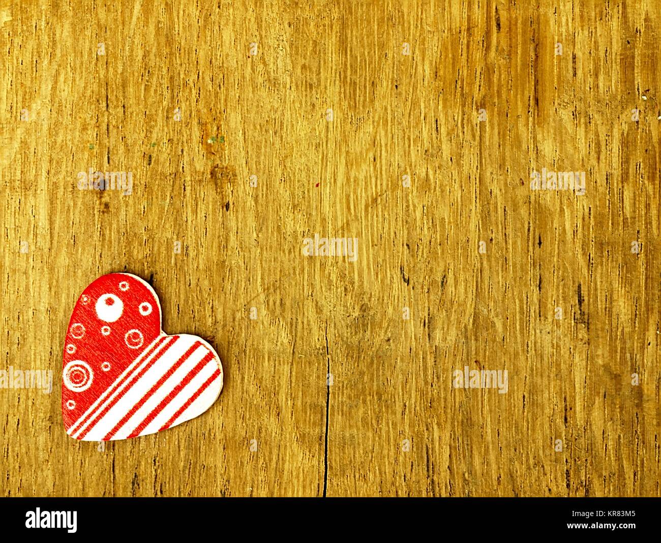 Wooden heart on the oak table Stock Photo - Alamy