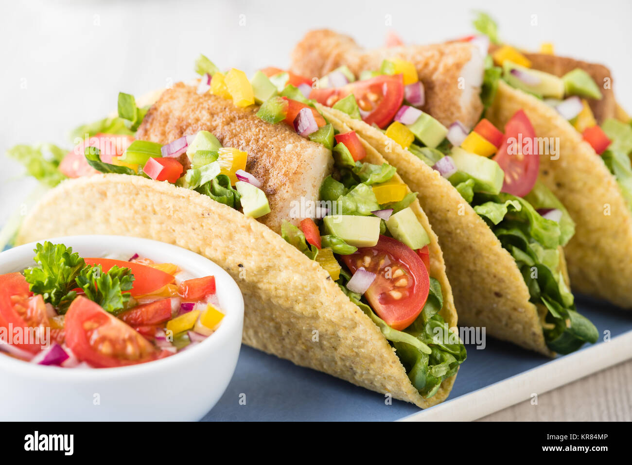 Fish tacos shell with avocado salsa Stock Photo - Alamy