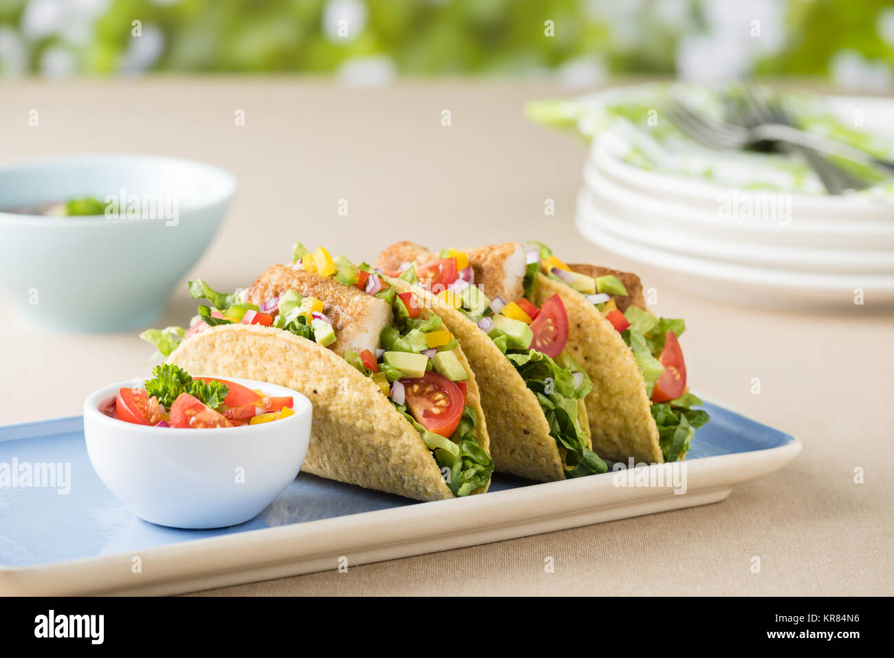 Fish tacos shell with avocado salsa Stock Photo - Alamy