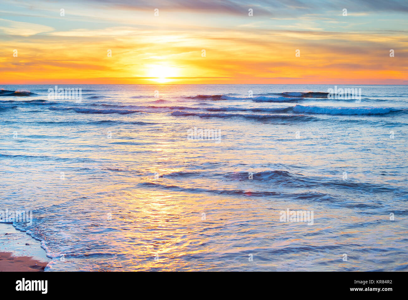 Sunset in the ocean Stock Photo - Alamy