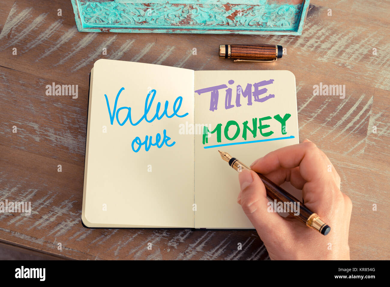 Handwritten text Value Time Over Money Stock Photo - Alamy
