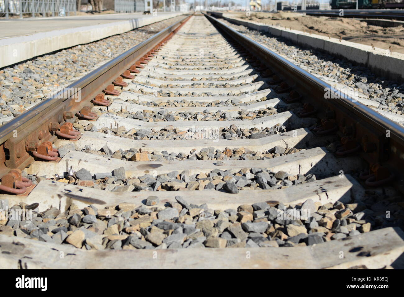 Railroad tracks at the train station Stock Photo - Alamy