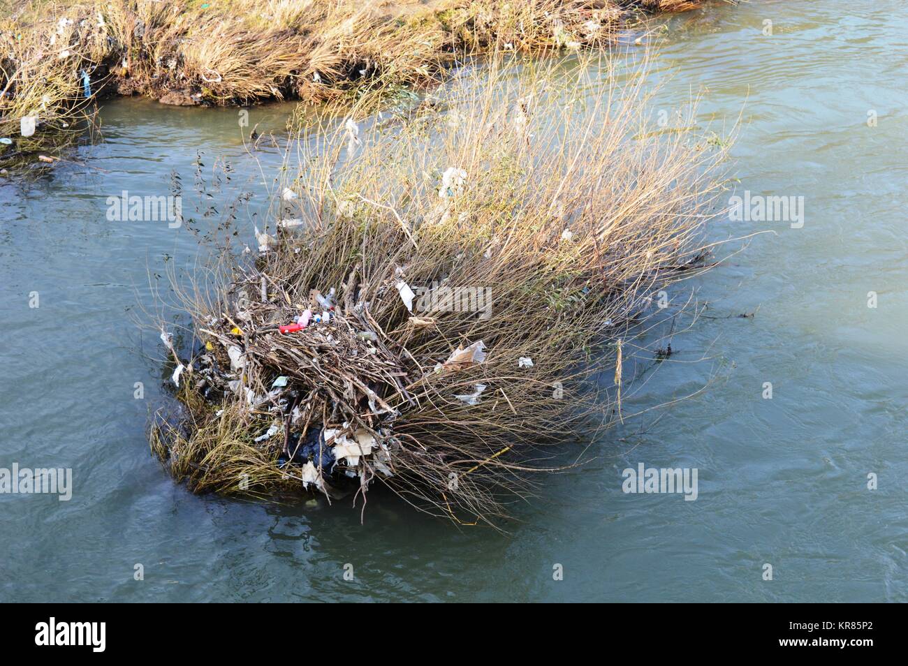 garbage by the river Stock Photo - Alamy