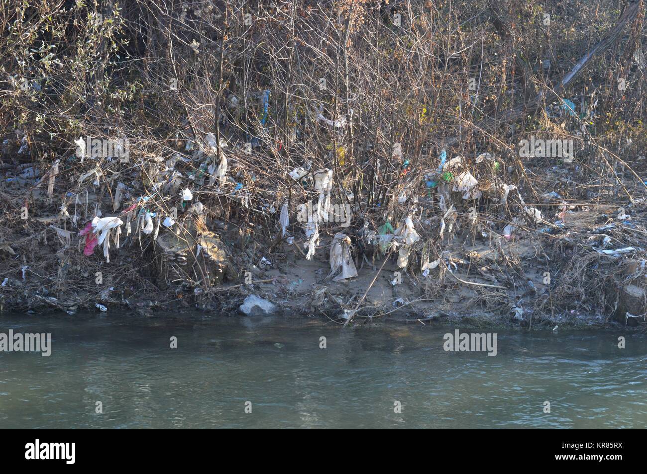 garbage by the river Stock Photo - Alamy