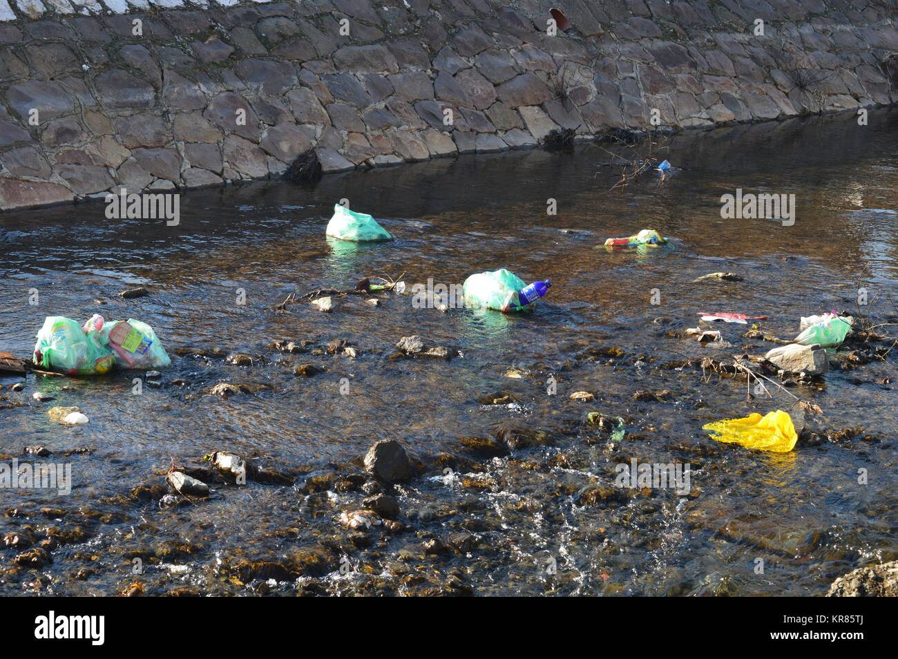 garbage by the river Stock Photo - Alamy