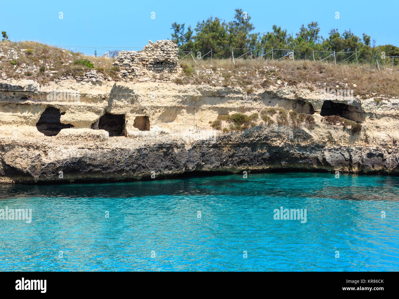 Ancient small caves on picturesque Adriatic sea coast (Archaeological ...