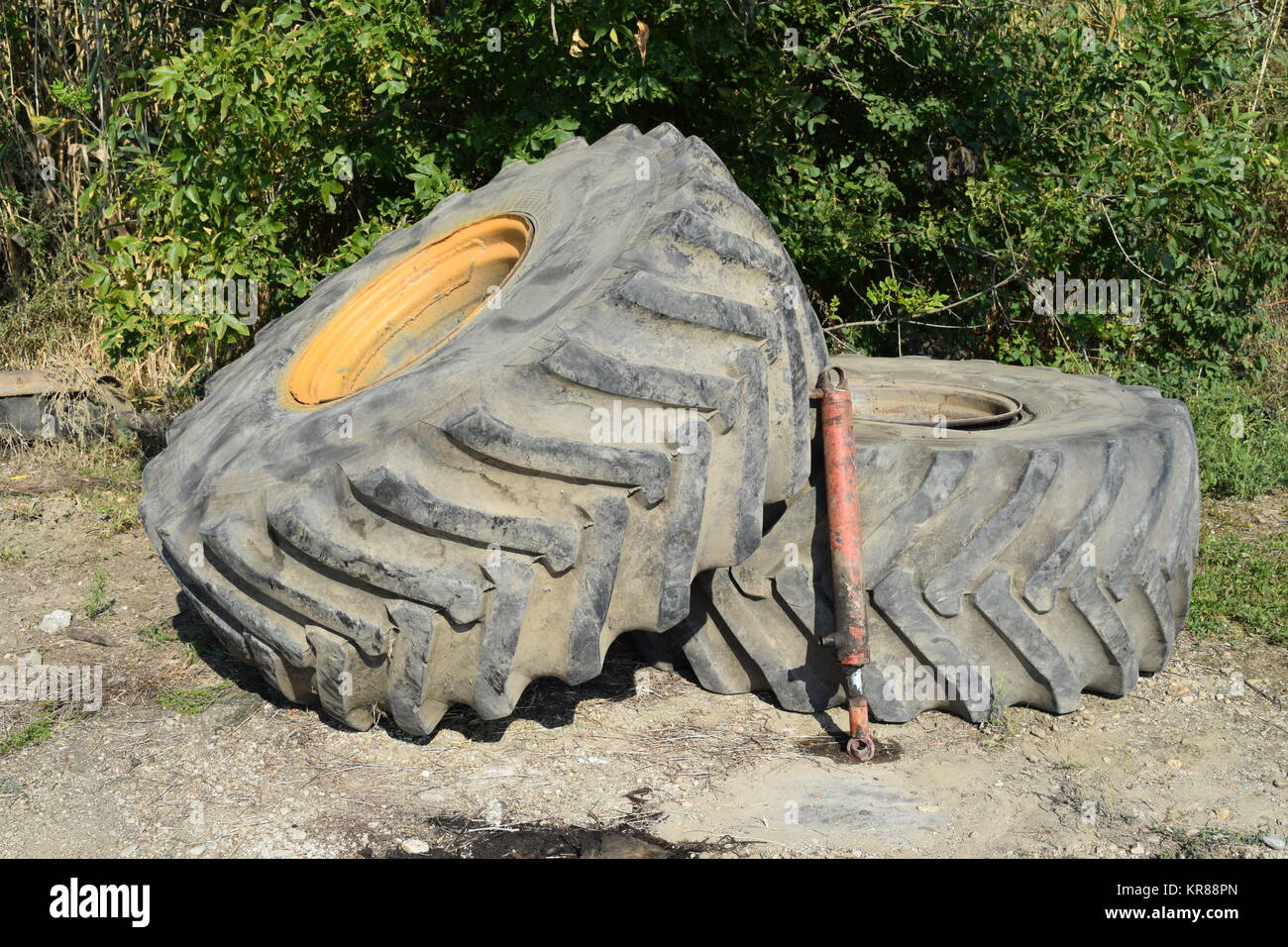 Broken flat tire on a large tractor Stock Photo - Alamy