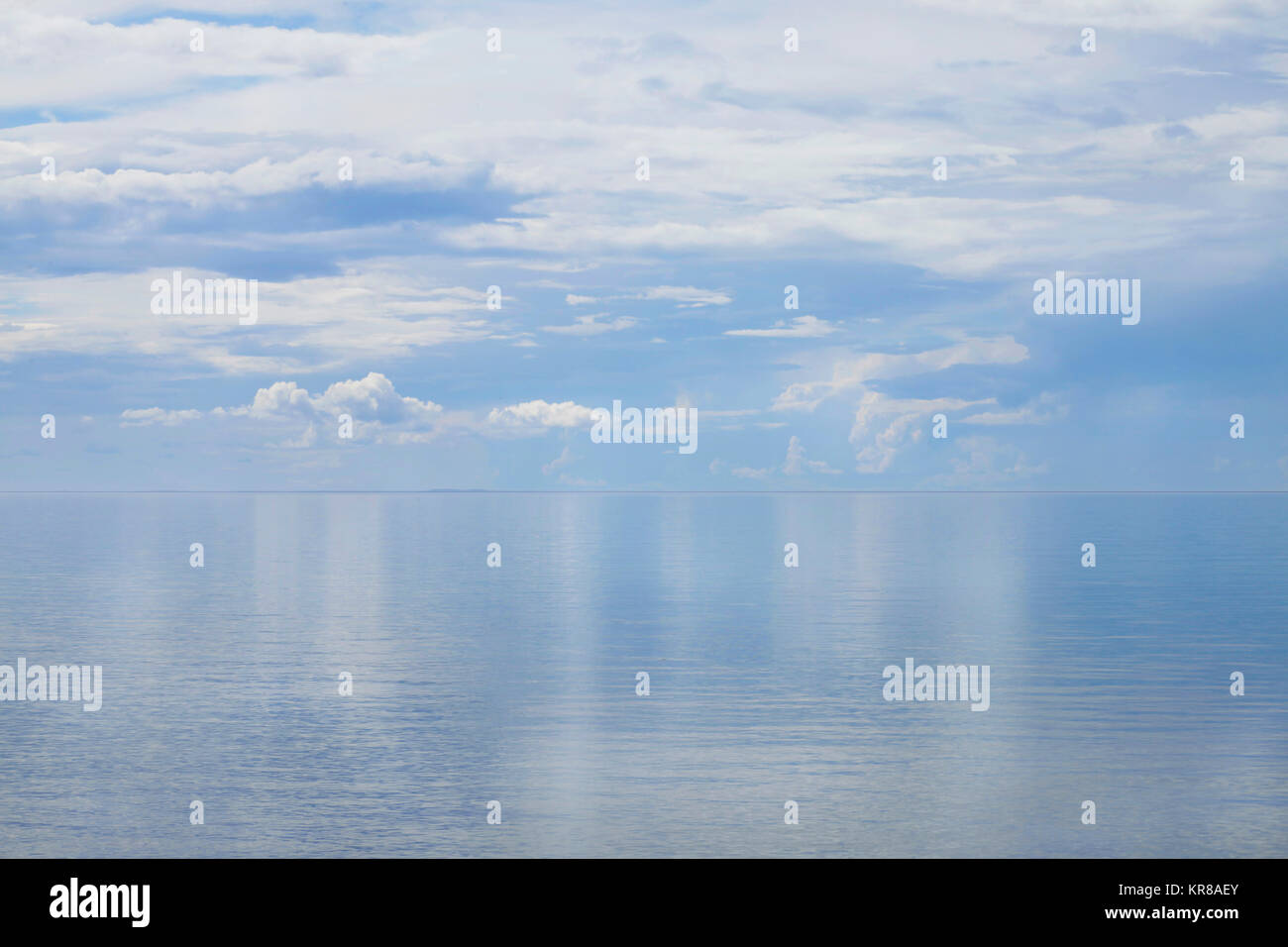 Reflection of the sky and clouds on the surface of the sea in the ...