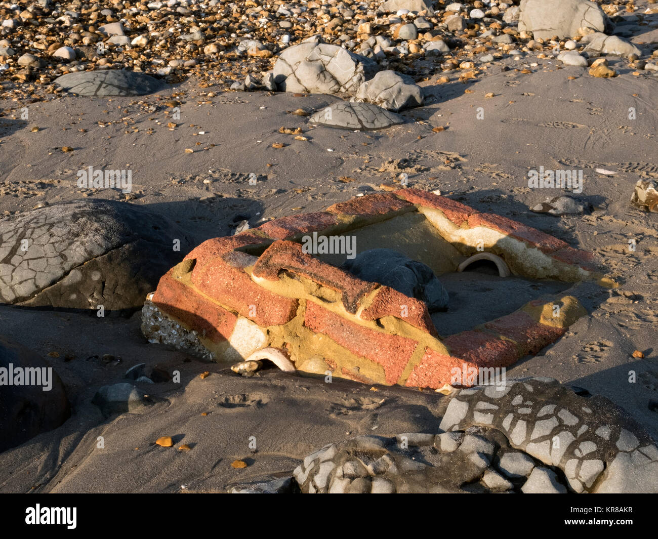 Evidence of cliff and coastal erosion, lost buildings and exposed ...