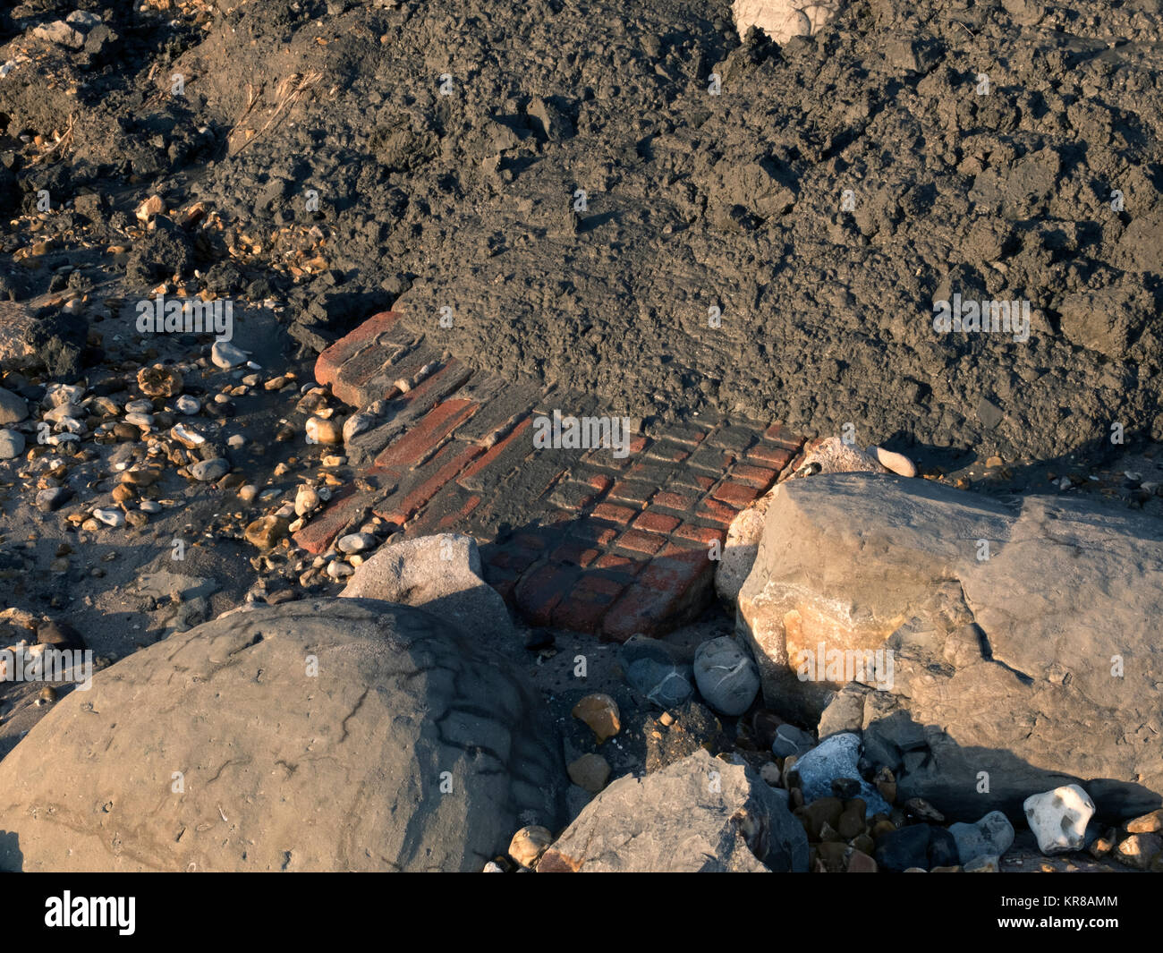 Evidence of cliff and coastal erosion, lost buildings and exposed ...