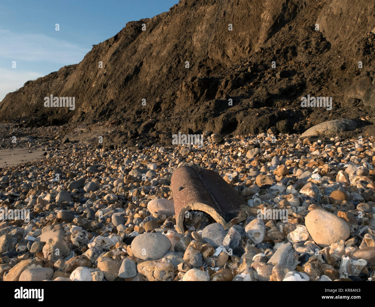 Evidence of cliff and coastal erosion, lost buildings and exposed ...