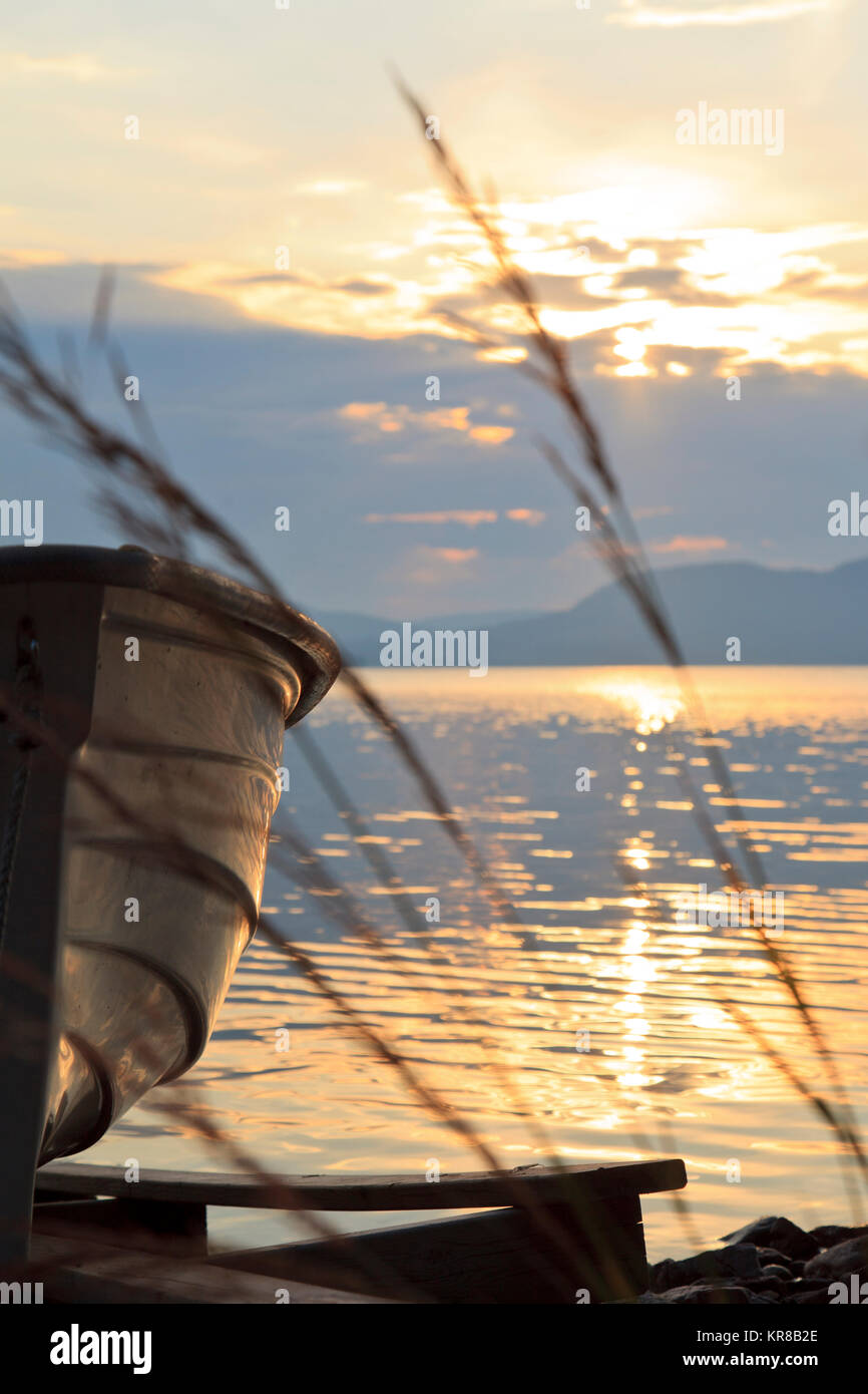 boat in sunset on the lake Stock Photo - Alamy