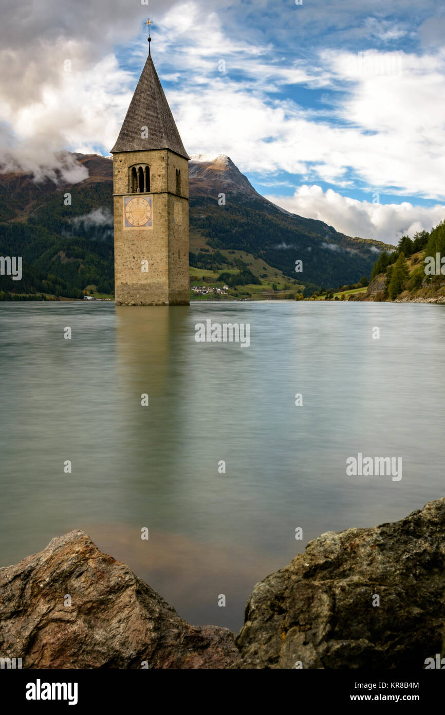 Sunk church in lake with mountain panorama Stock Photo - Alamy