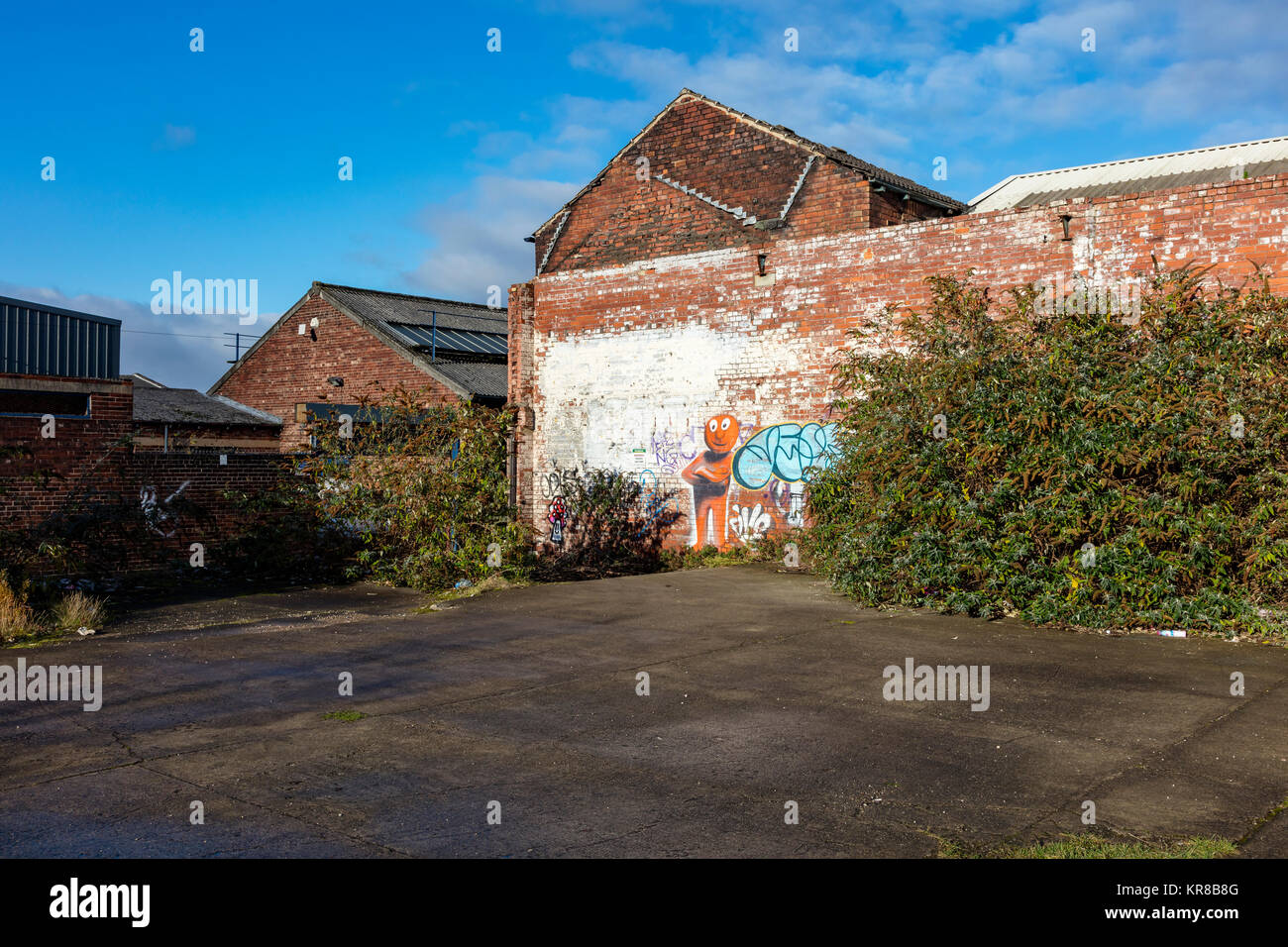 Graffiti on the wall of an old factory building in the centre of ...