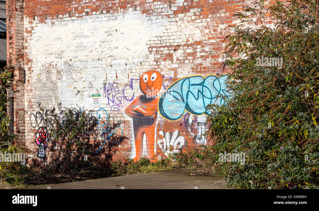 Graffiti on the wall of an old factory building in the centre of ...