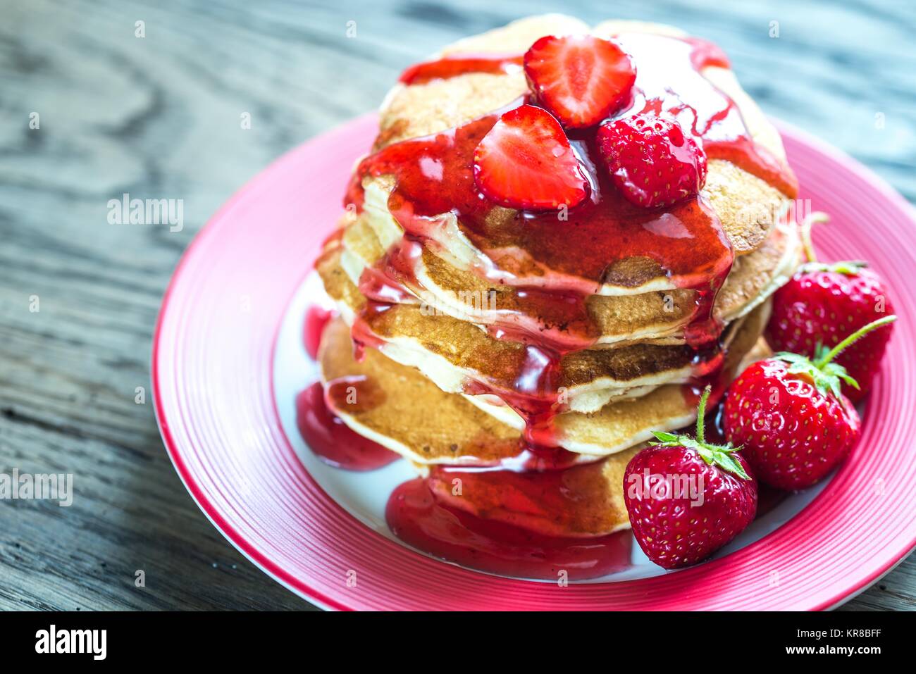 Pancakes with strawberry jam Stock Photo - Alamy