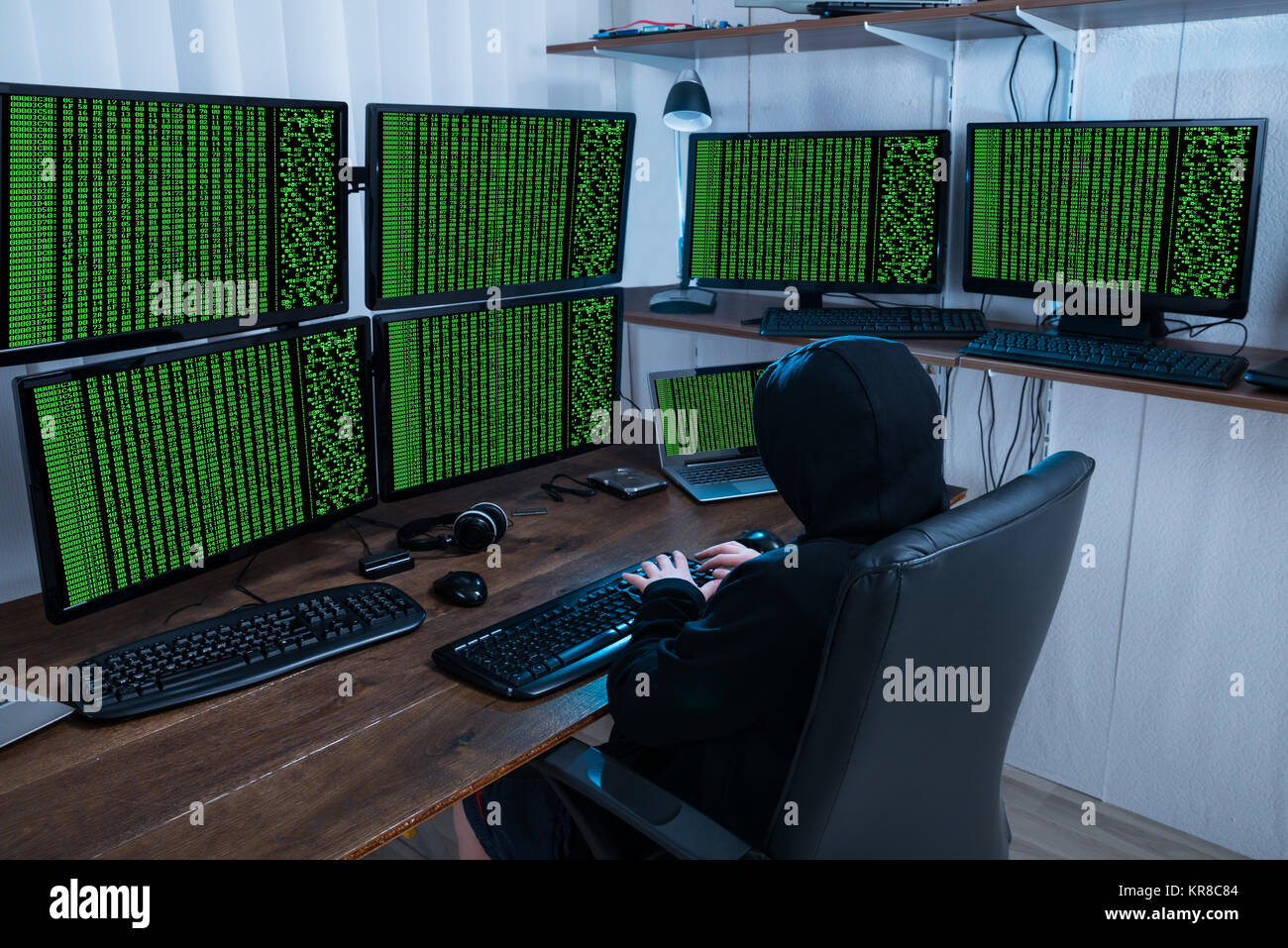Boy Stealing Information From Multiple Computers Stock Photo - Alamy