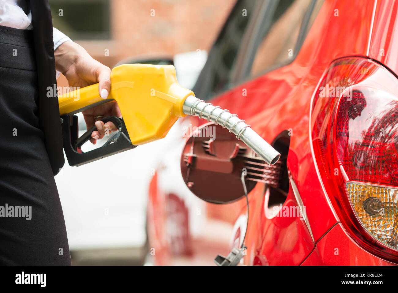 Close-up Of Businesswoman's Hand Refueling Car's Tank Stock Photo - Alamy