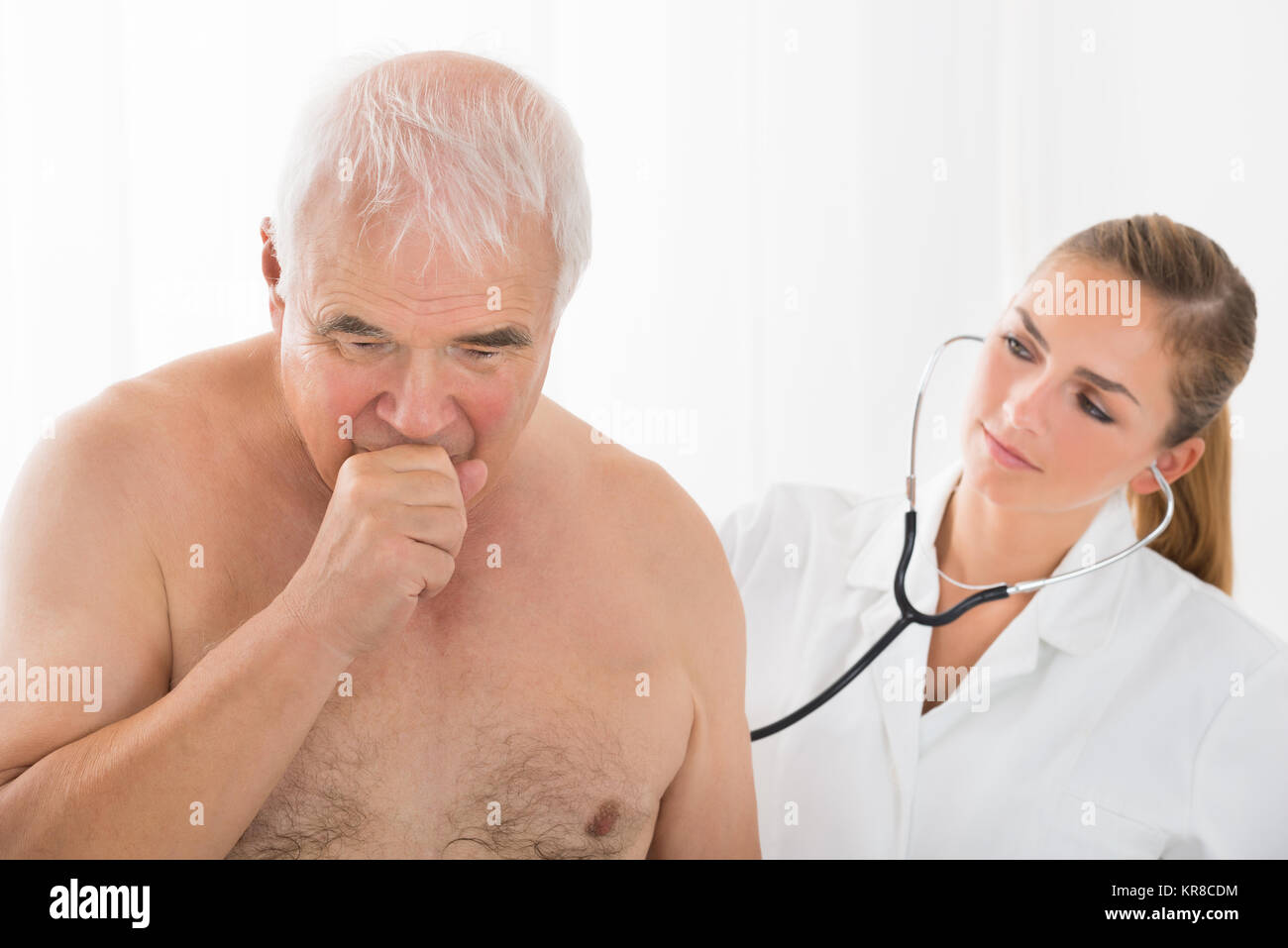 Doctor Using Stethoscope On Patient's Back Stock Photo - Alamy