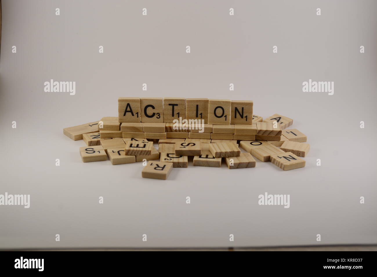 word Action written in scrabble tiles Stock Photo - Alamy