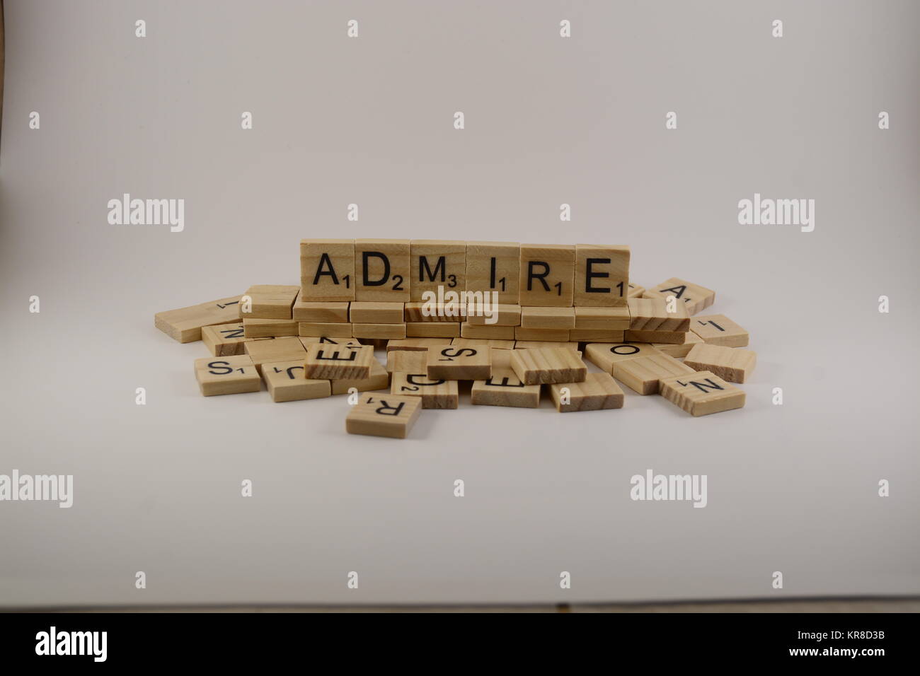 word Admire written in scrabble tiles Stock Photo - Alamy