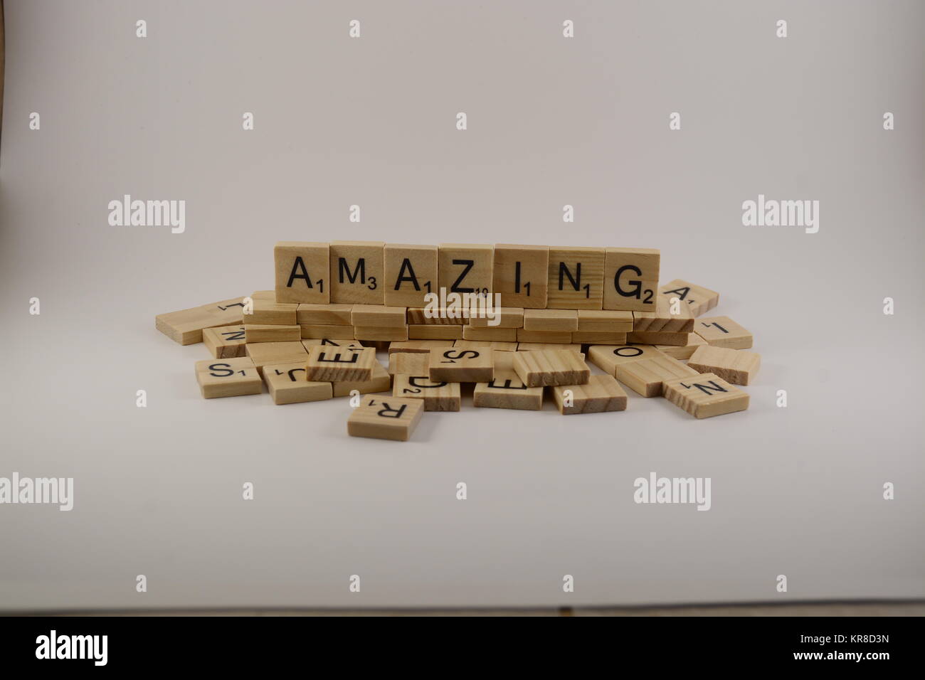 word Amazing written in scrabble tiles Stock Photo - Alamy