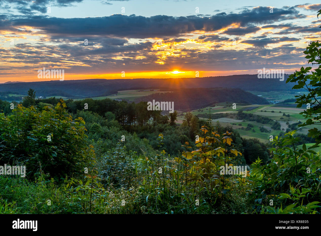 Sunset in beautiful scenery Stock Photo - Alamy