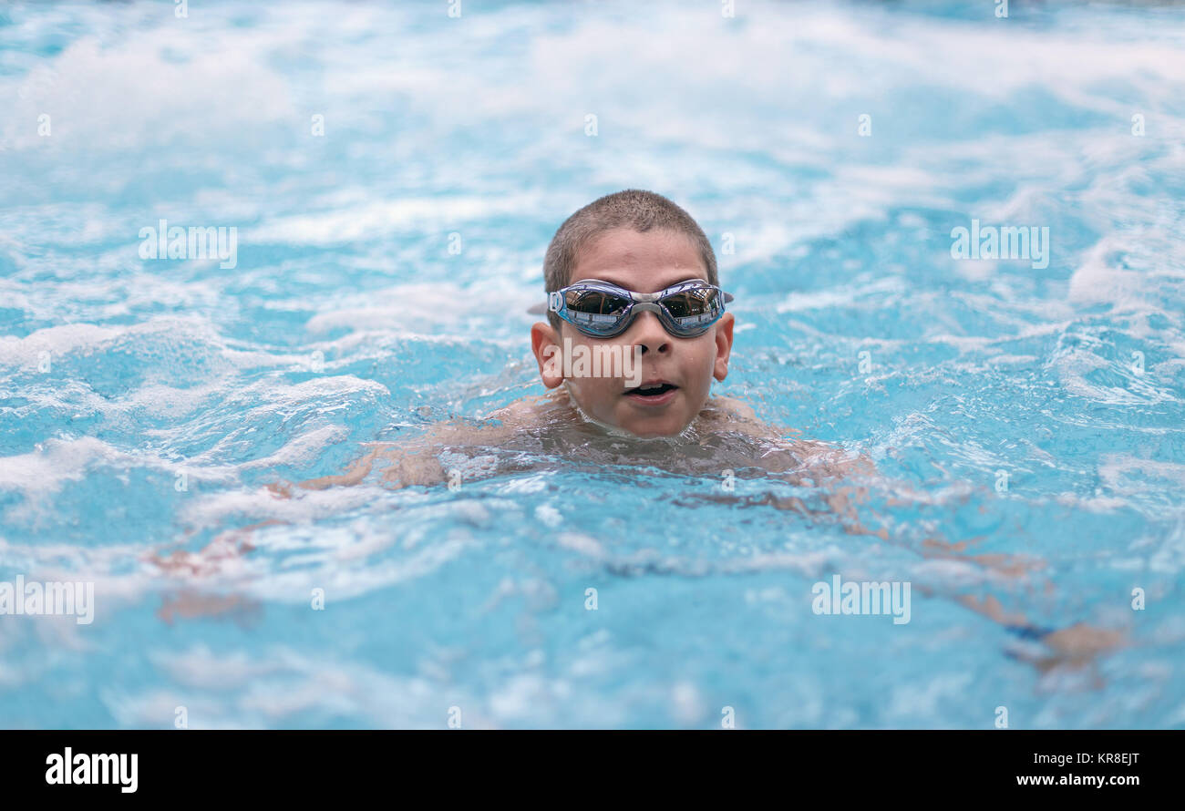 Boy swimming in pool Stock Photo - Alamy