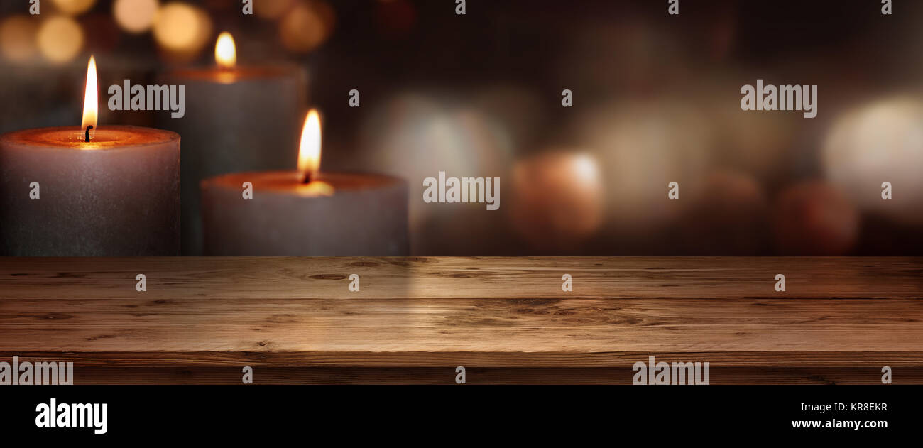 wooden table with candles background Stock Photo - Alamy