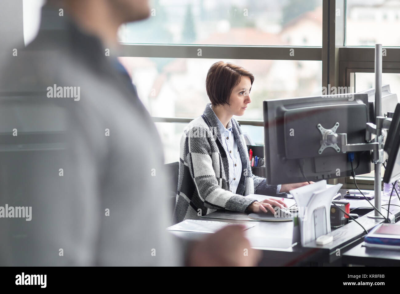 Personal assistant working in corporate office Stock Photo - Alamy