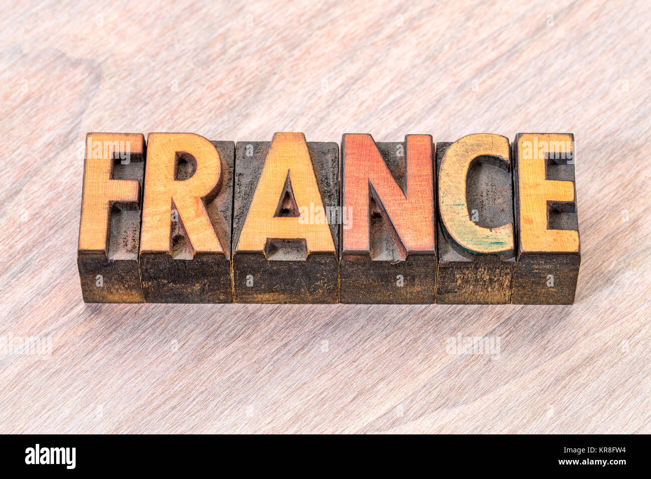 France word in vintage letterpress wood type against grained wood Stock ...