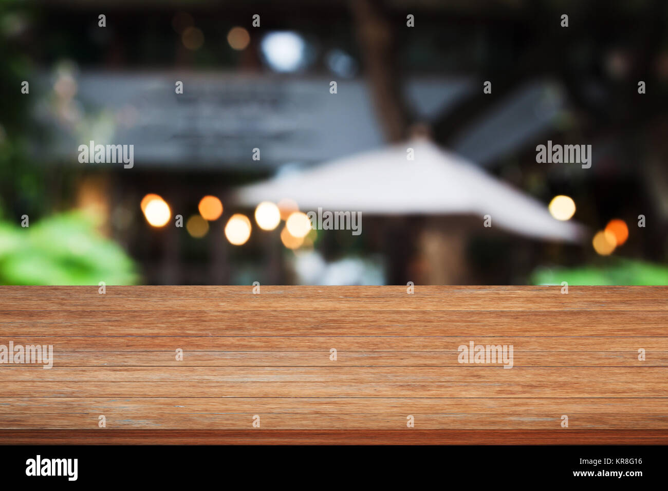 Top of brown wooden table with cafe background Stock Photo - Alamy