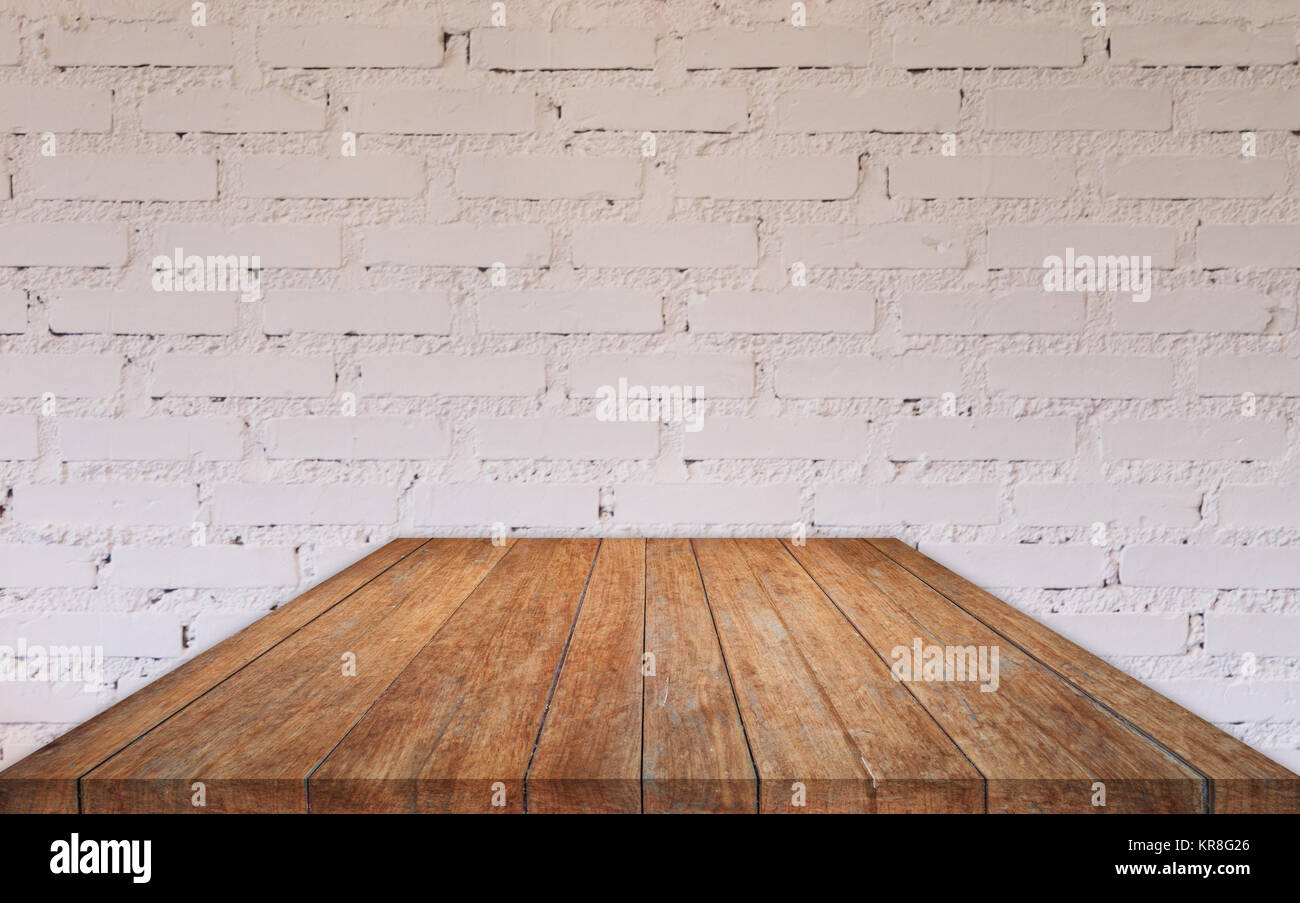Perspective wooden table top with brick wall Stock Photo - Alamy