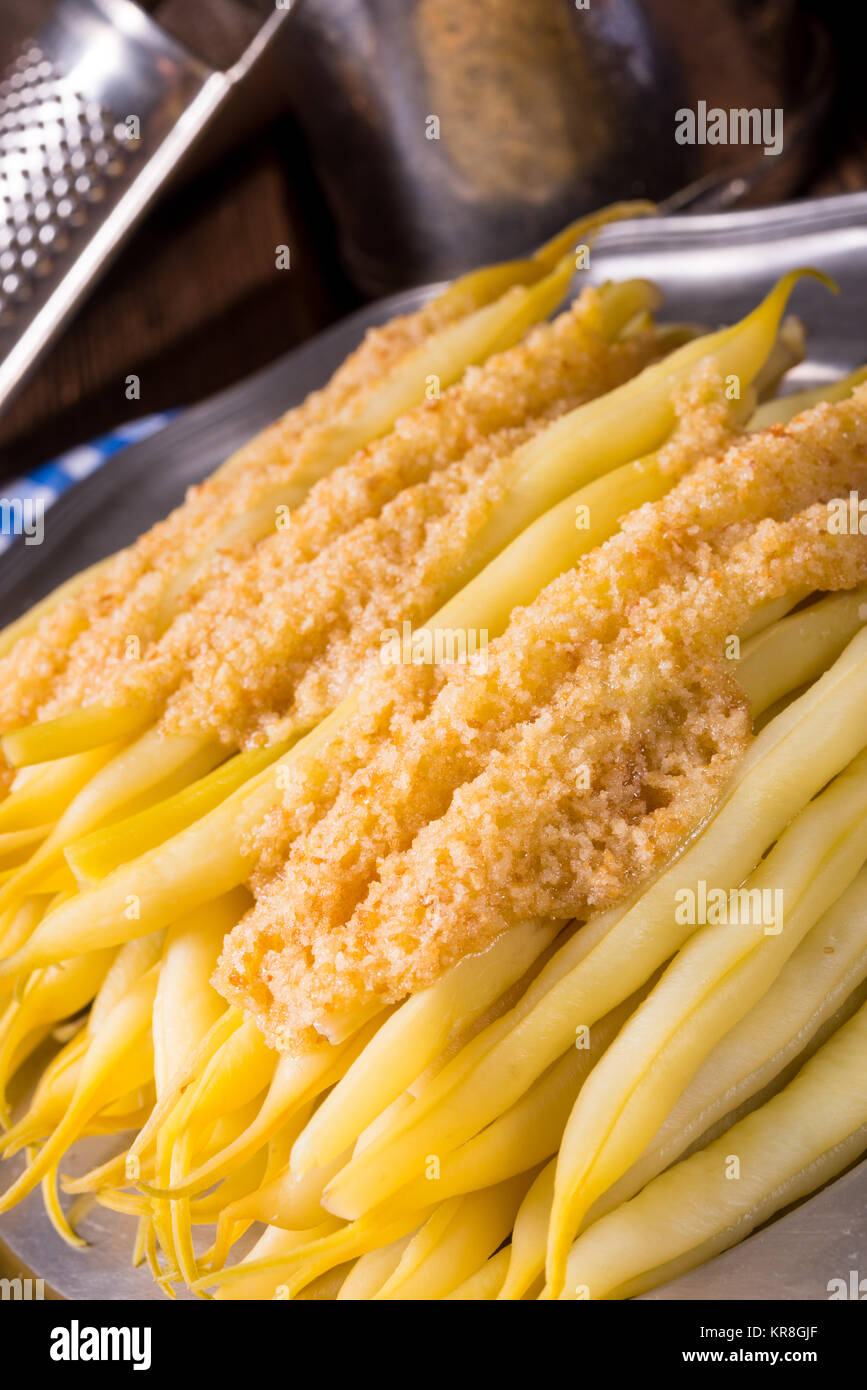 yellow string bean with breadcrumbs Stock Photo - Alamy