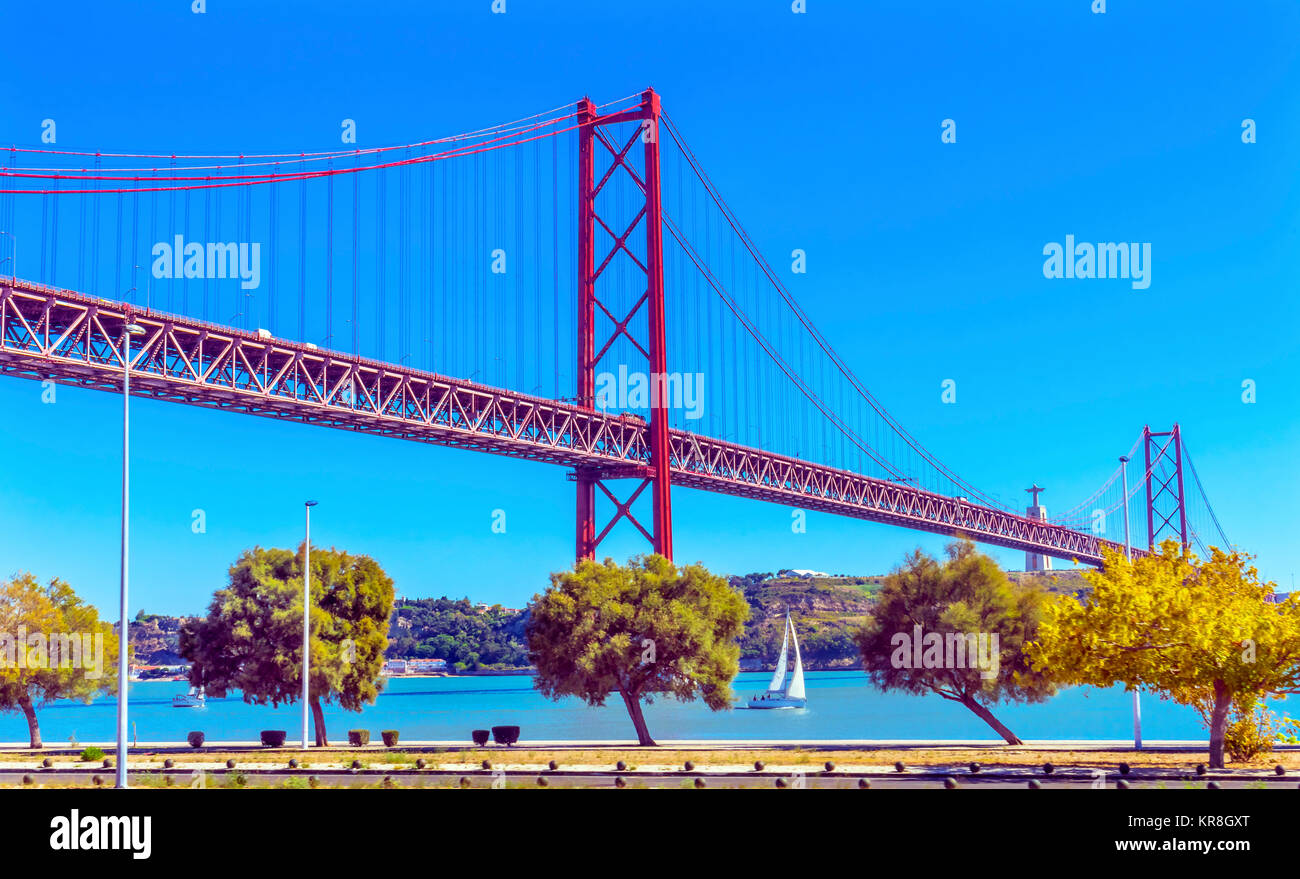 Tagus River Bridge April 25 Ponte 25 de Abril Lisbon Portugal. Sailboat ...