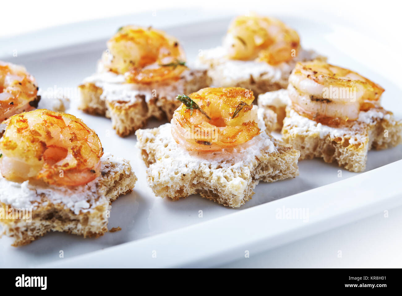 appetizer canape with fried shrimps. catering food Stock Photo - Alamy