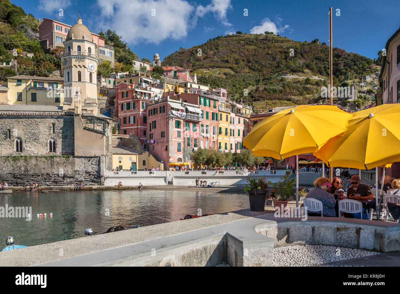 Yellow umbrellas at a portside restaurant in the village of Vernazza ...