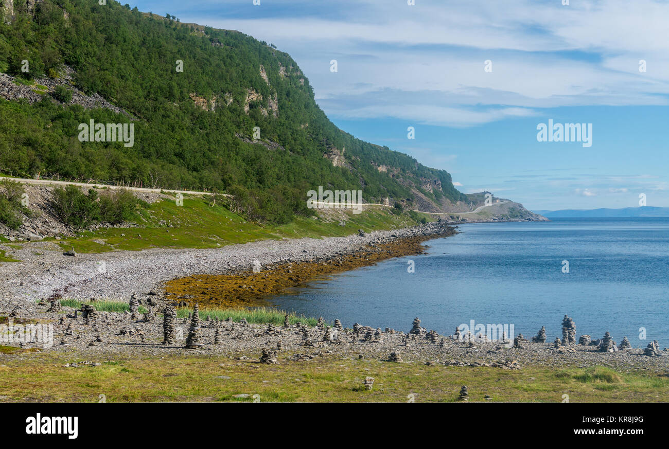 Pyramids made of stones on the beach of Porsanger Fjord, Finnmark ...