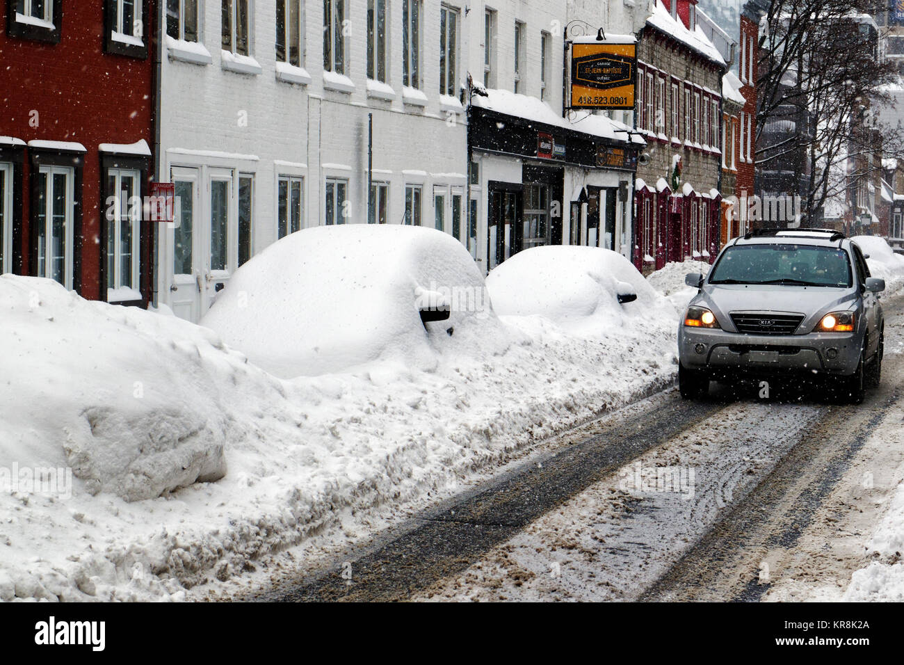 Cars completely buried in snow in Quebec City during a big snowstorm ...