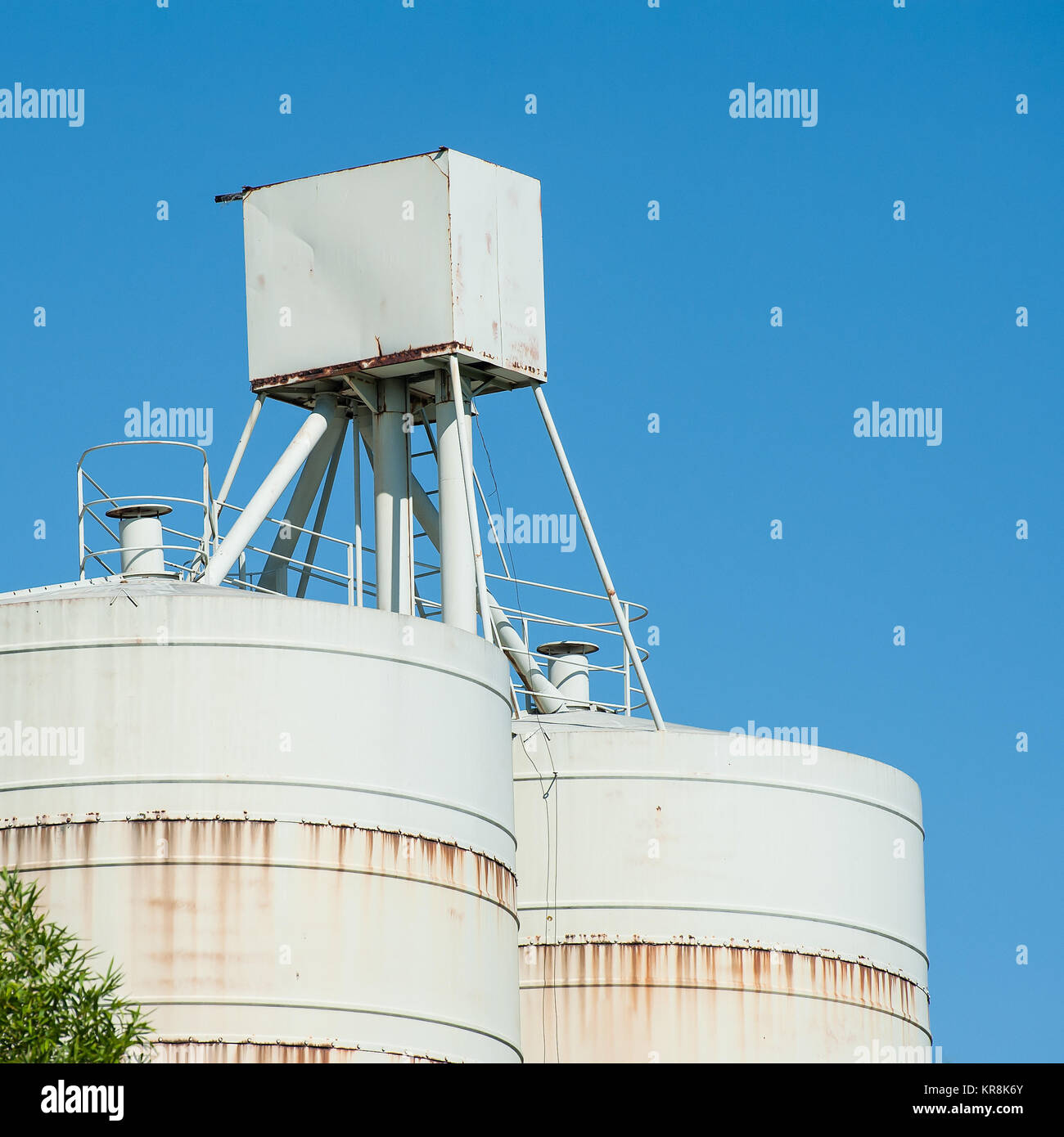 White silos for the storage of lime and cement Stock Photo - Alamy